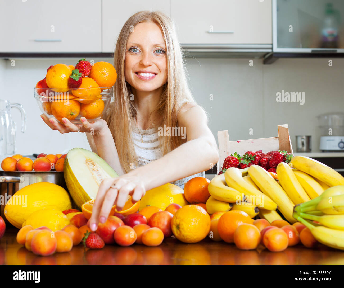 woman choosing fruits in home kitchen Stock Photo - Alamy