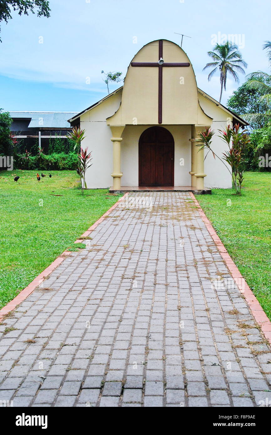 Beautiful small white church led to by paved path in the small Costa ...