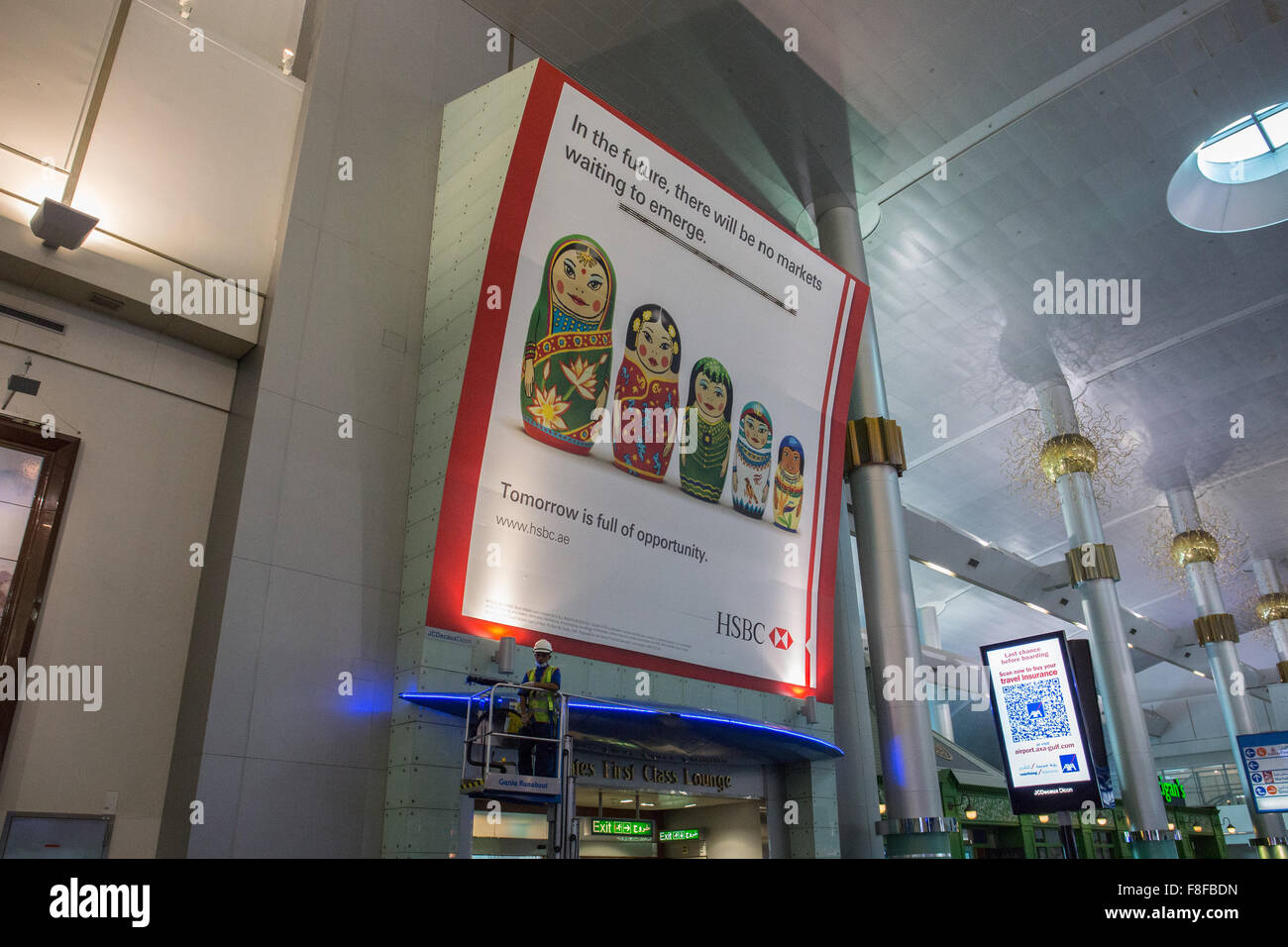 Emirates First Class entrance and HSBC advertisement Stock Photo - Alamy
