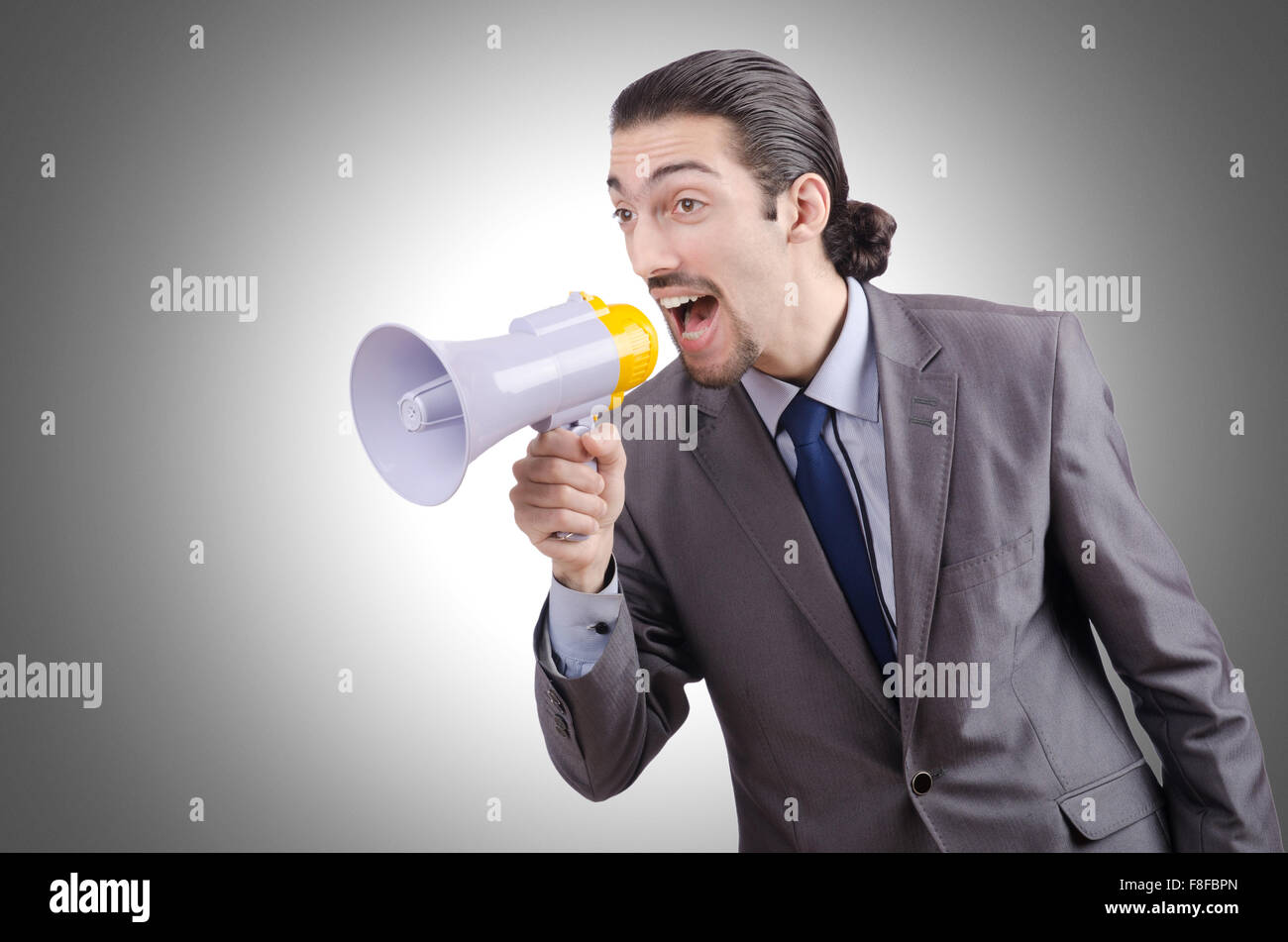 Man shouting and yelling with loudspeaker Stock Photo - Alamy