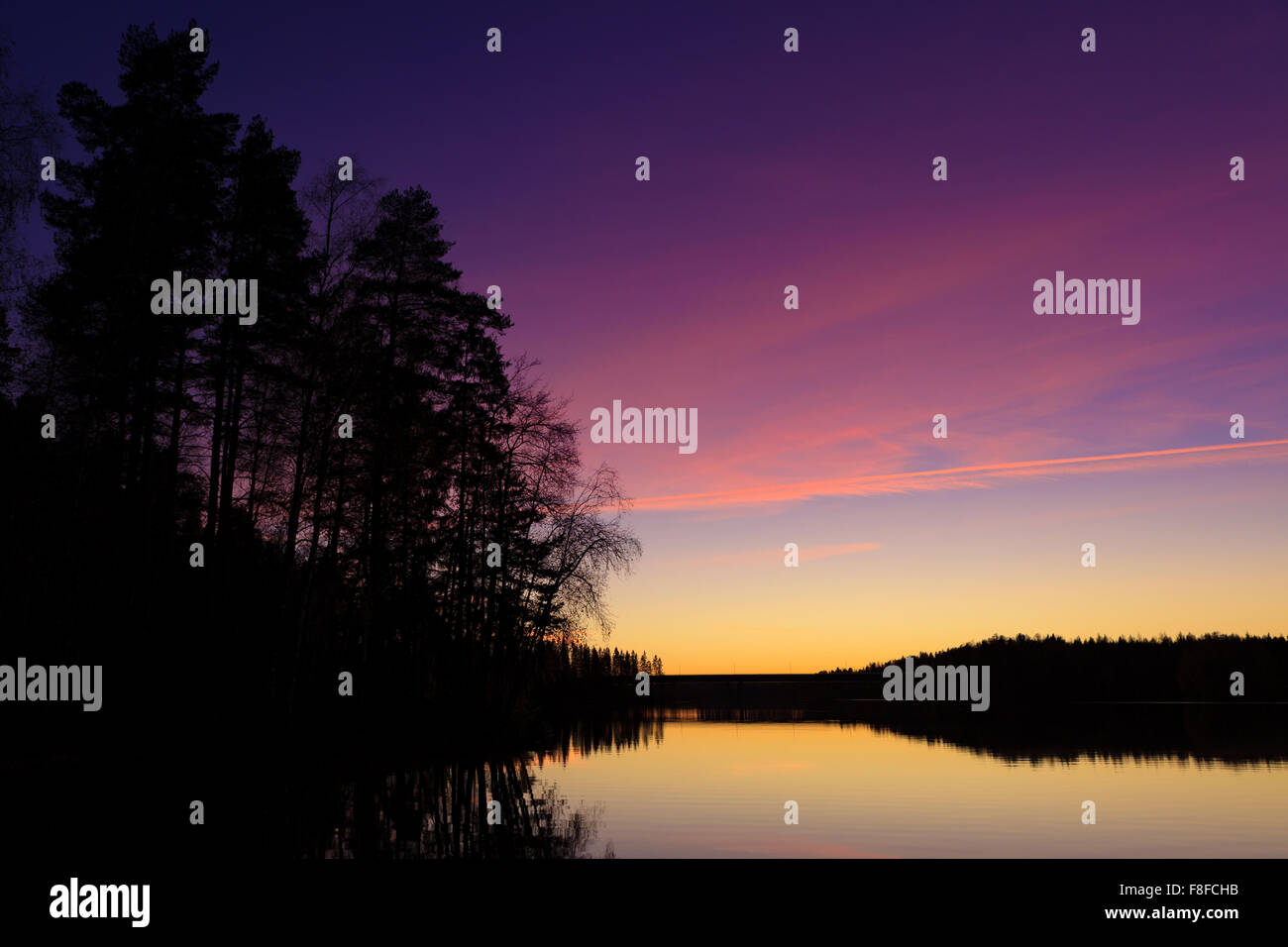 Serene view of calm lake at twilight Stock Photo - Alamy