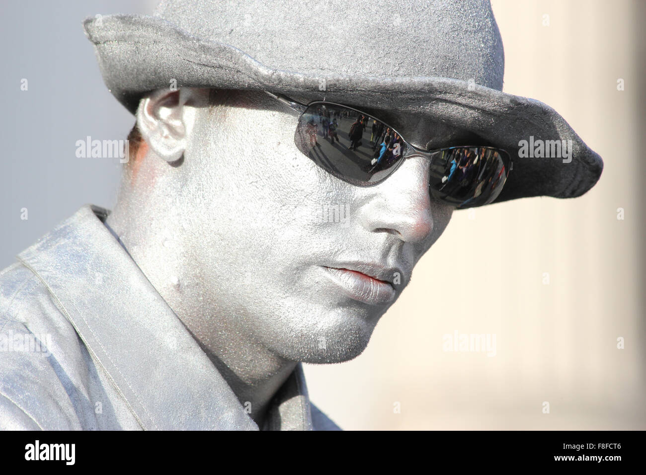 Close up of street performer covered in silver paint, members of the ...