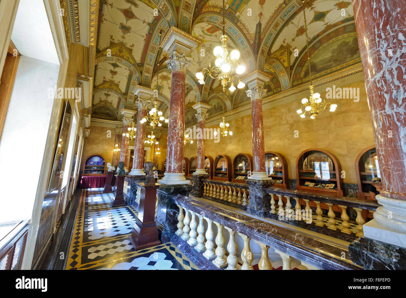 The beautiful interior with marble pillars and decorated ceiling at the ...