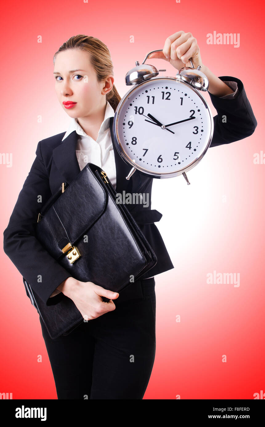 Woman businesswoman with giant clock Stock Photo - Alamy