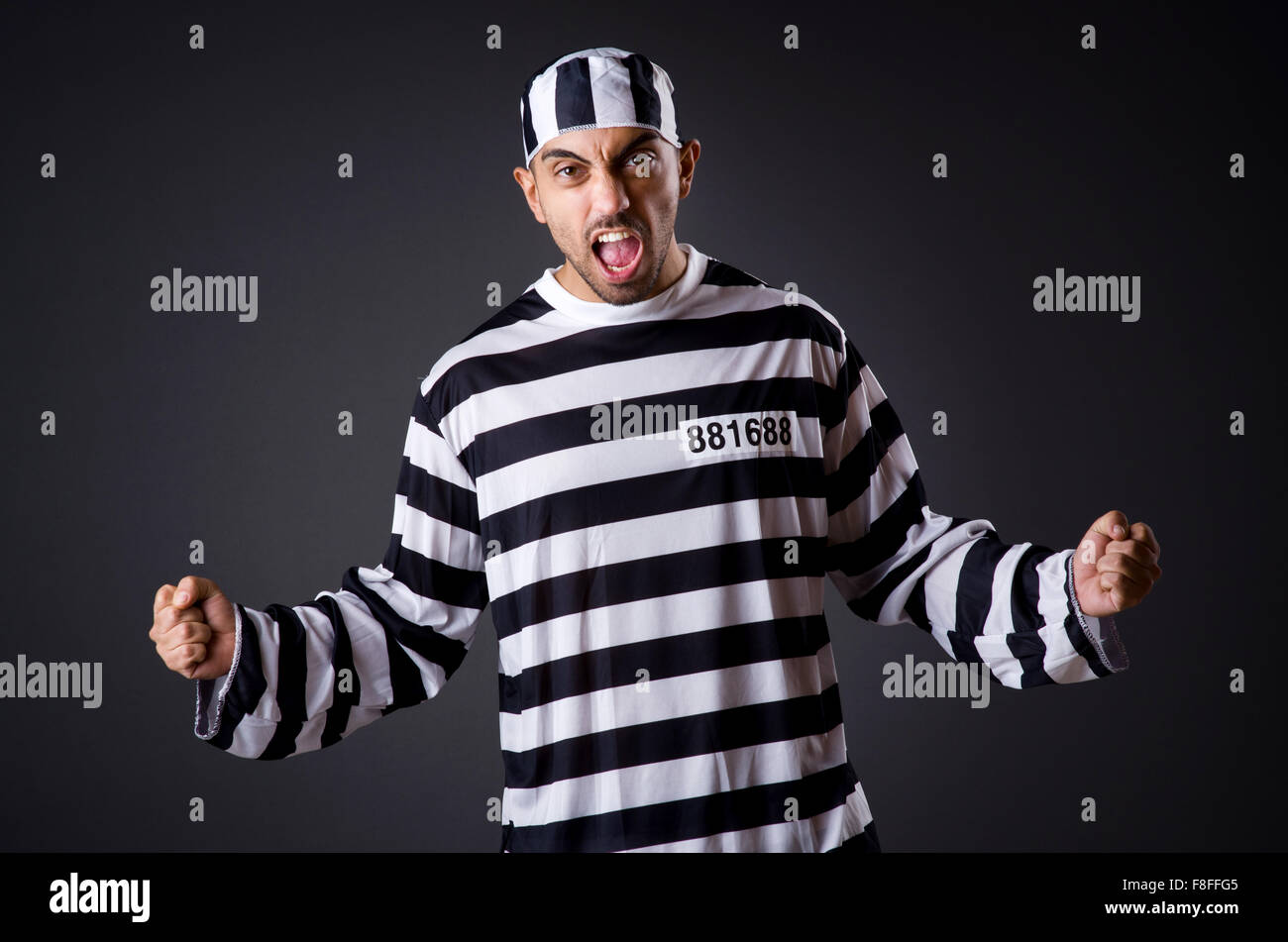 Angry prison inmate in dark hi-res stock photography and images - Alamy