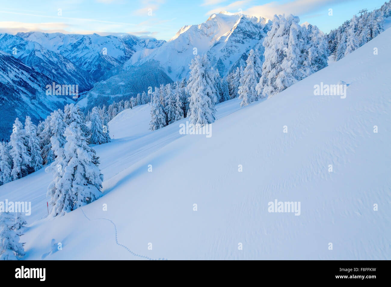 Morning in the snowy mountains Stock Photo - Alamy