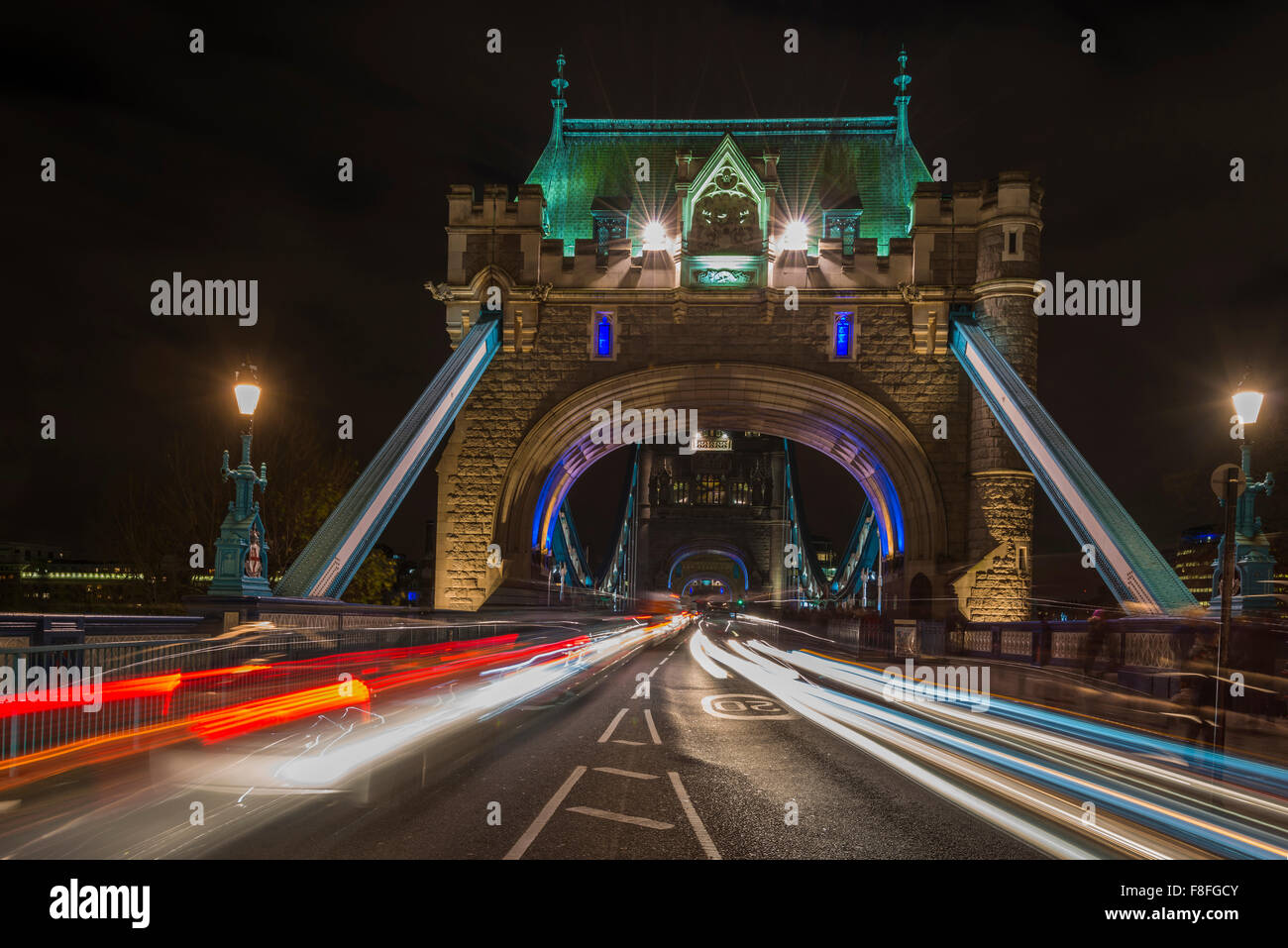 Traffic light trails on Tower Bridge in London at night Stock Photo - Alamy
