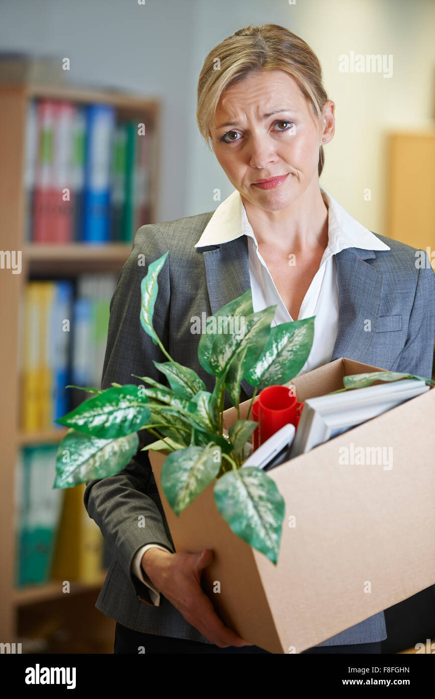 Redundant Businesswoman In Office Stock Photo - Alamy
