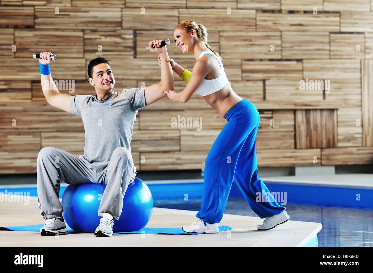 fitness personal trainer on fitness classes supporting group of people ...