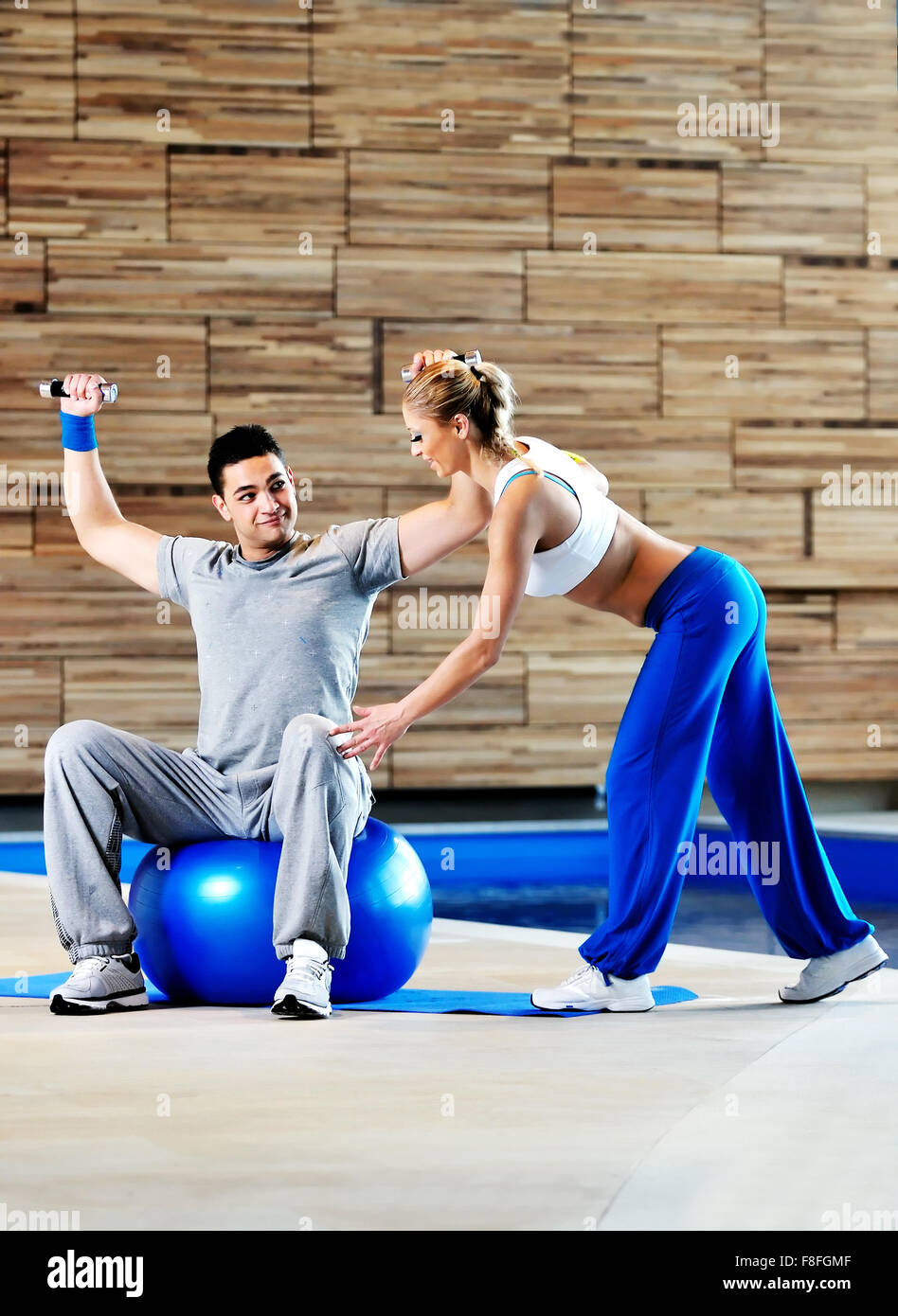 fitness personal trainer on fitness classes supporting group of people ...