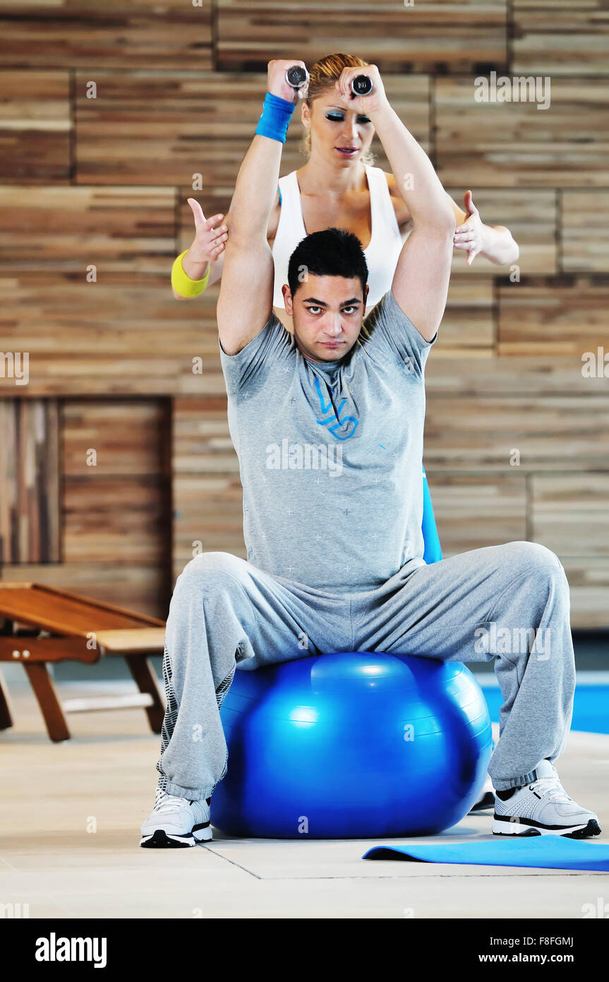 fitness personal trainer on fitness classes supporting group of people ...