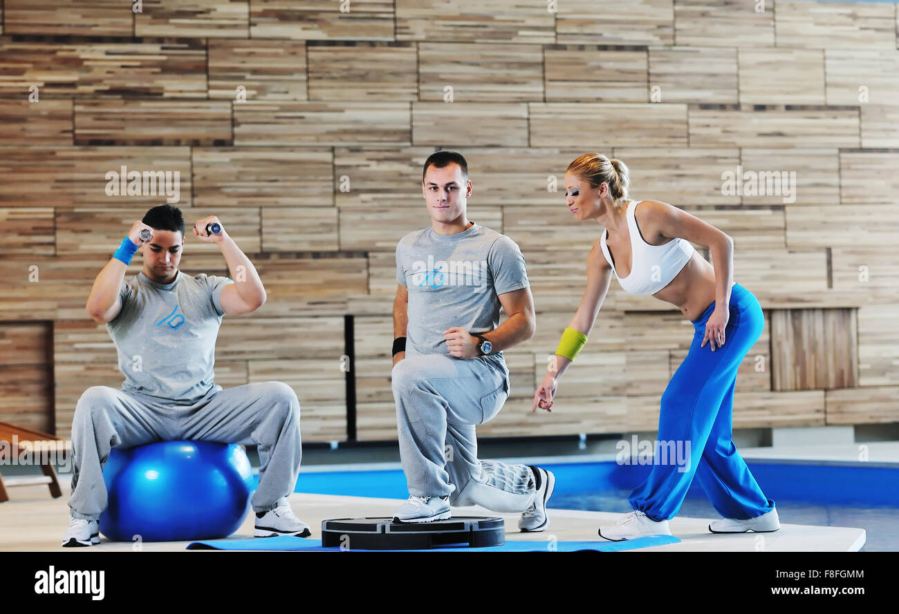 fitness personal trainer on fitness classes supporting group of people ...