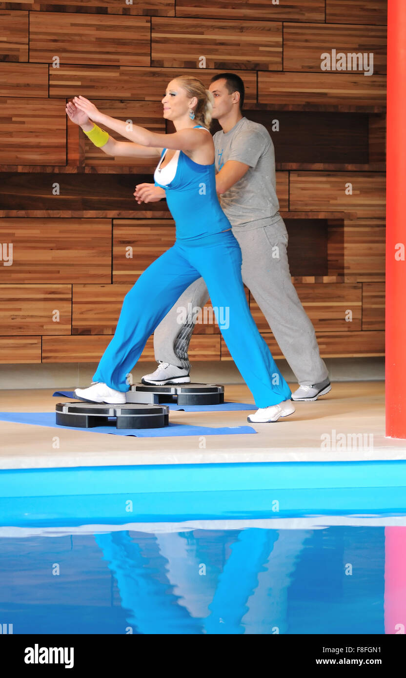 fitness personal trainer on fitness classes supporting group of people ...
