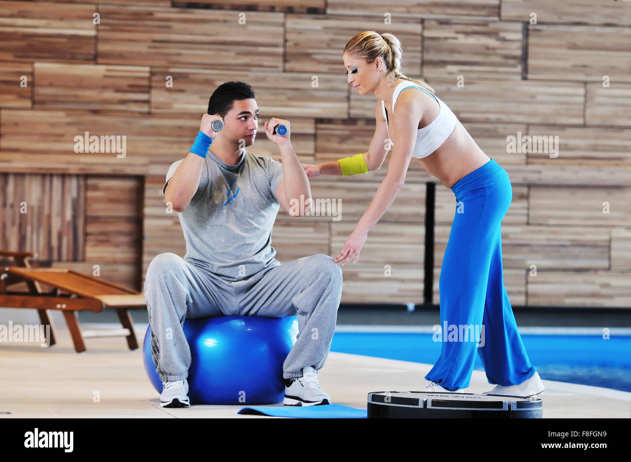 fitness personal trainer on fitness classes supporting group of people ...