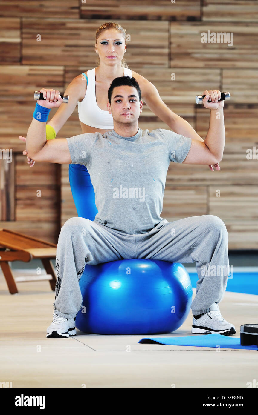 fitness personal trainer on fitness classes supporting group of people ...