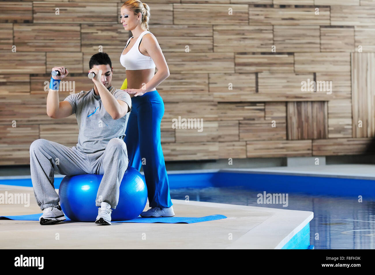 fitness personal trainer on fitness classes supporting group of people ...