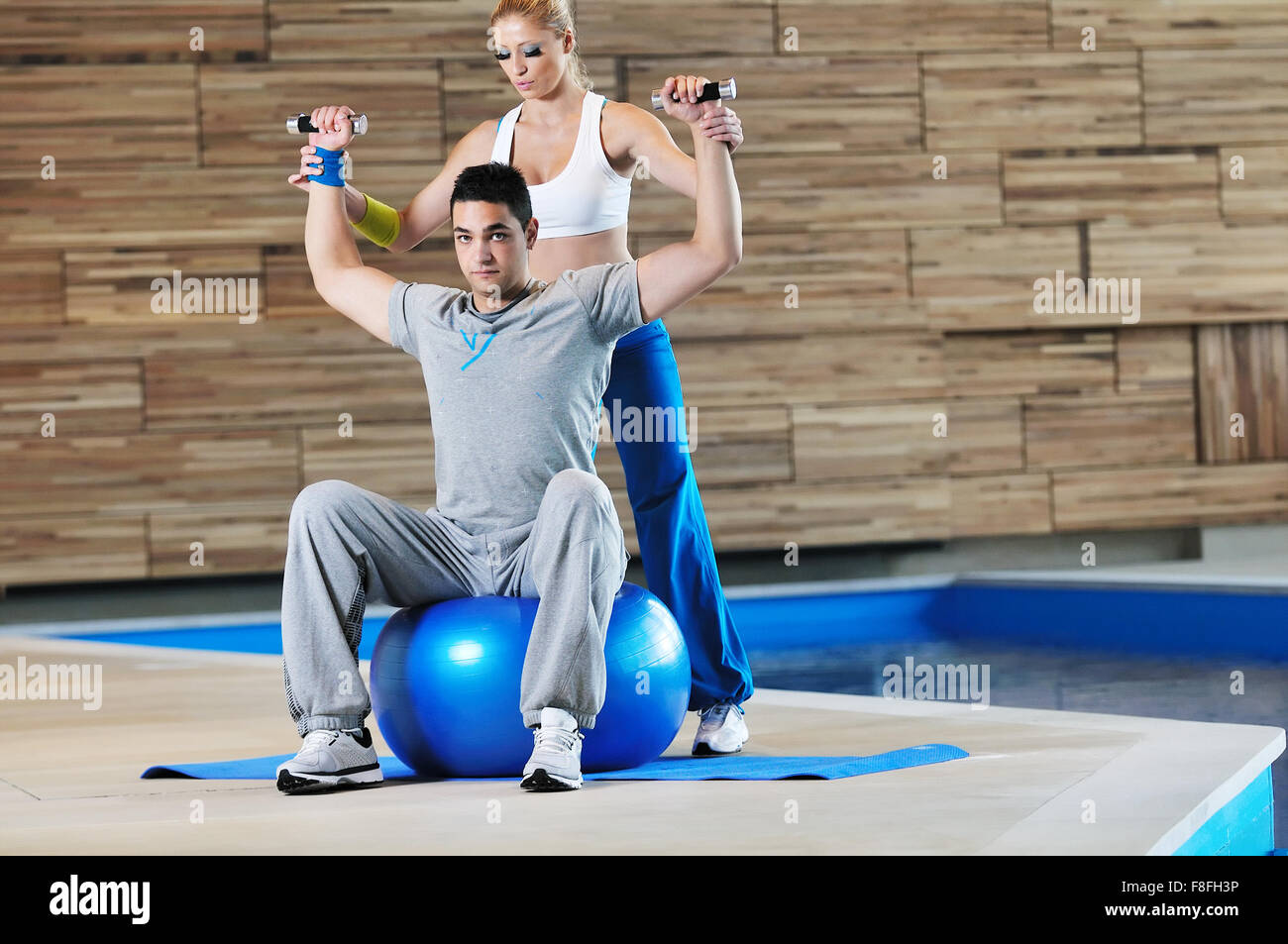 fitness personal trainer on fitness classes supporting group of people ...