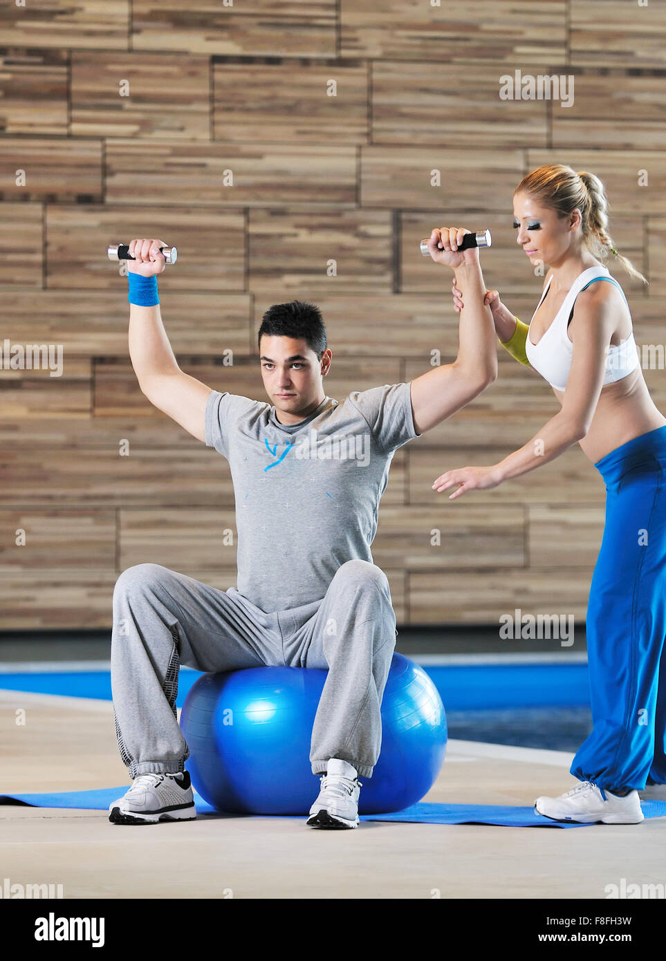 fitness personal trainer on fitness classes supporting group of people ...