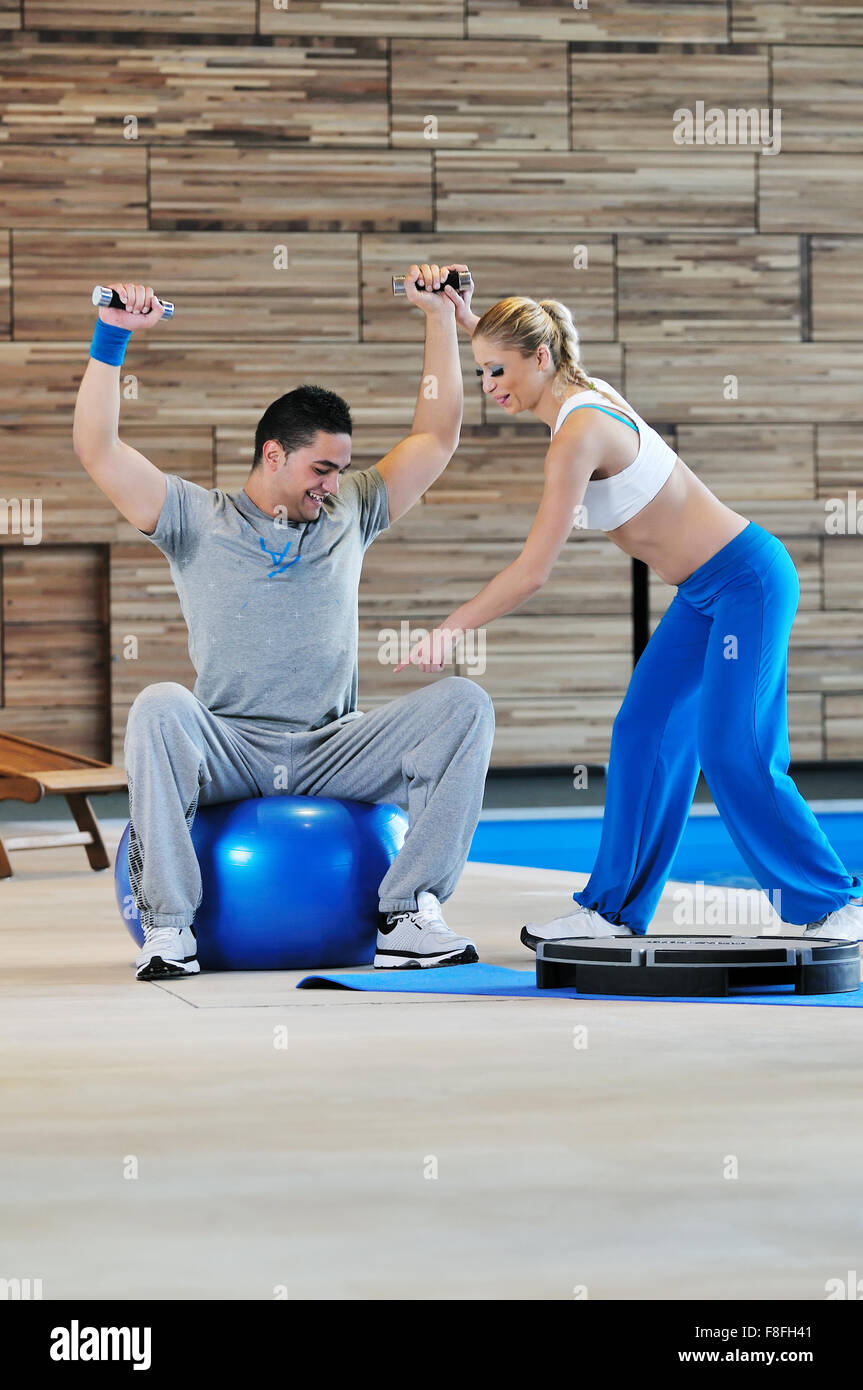 fitness personal trainer on fitness classes supporting group of people ...
