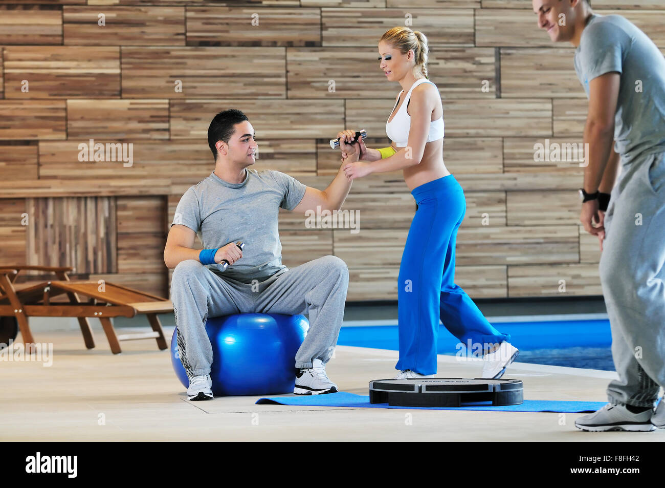 fitness personal trainer on fitness classes supporting group of people ...