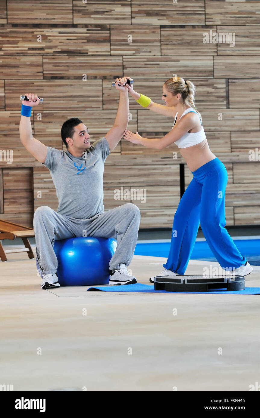 fitness personal trainer on fitness classes supporting group of people ...