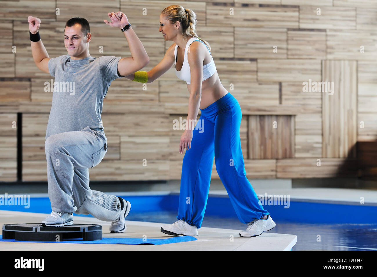 fitness personal trainer on fitness classes supporting group of people ...