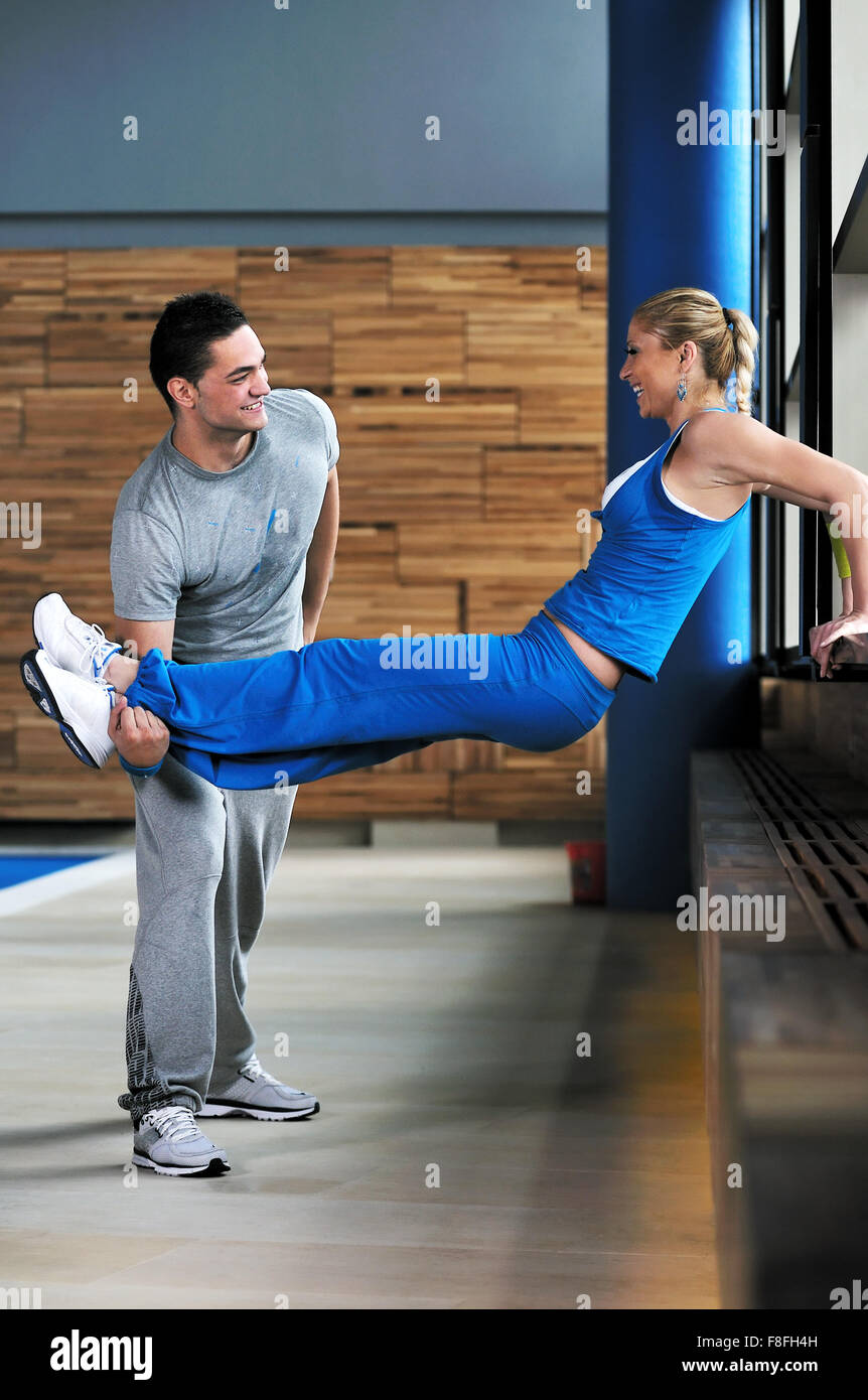 fitness personal trainer on fitness classes supporting group of people ...