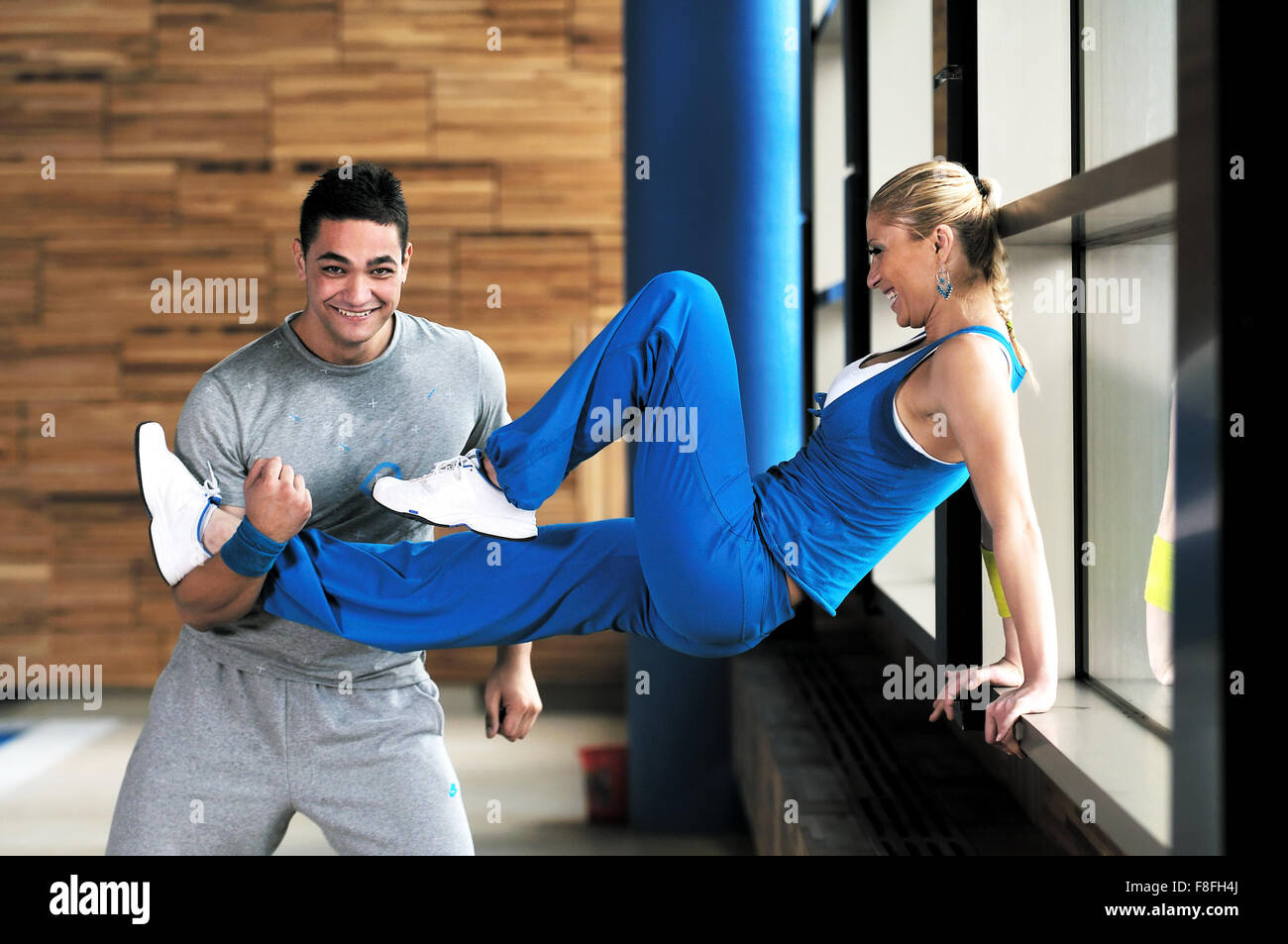 fitness personal trainer on fitness classes supporting group of people ...