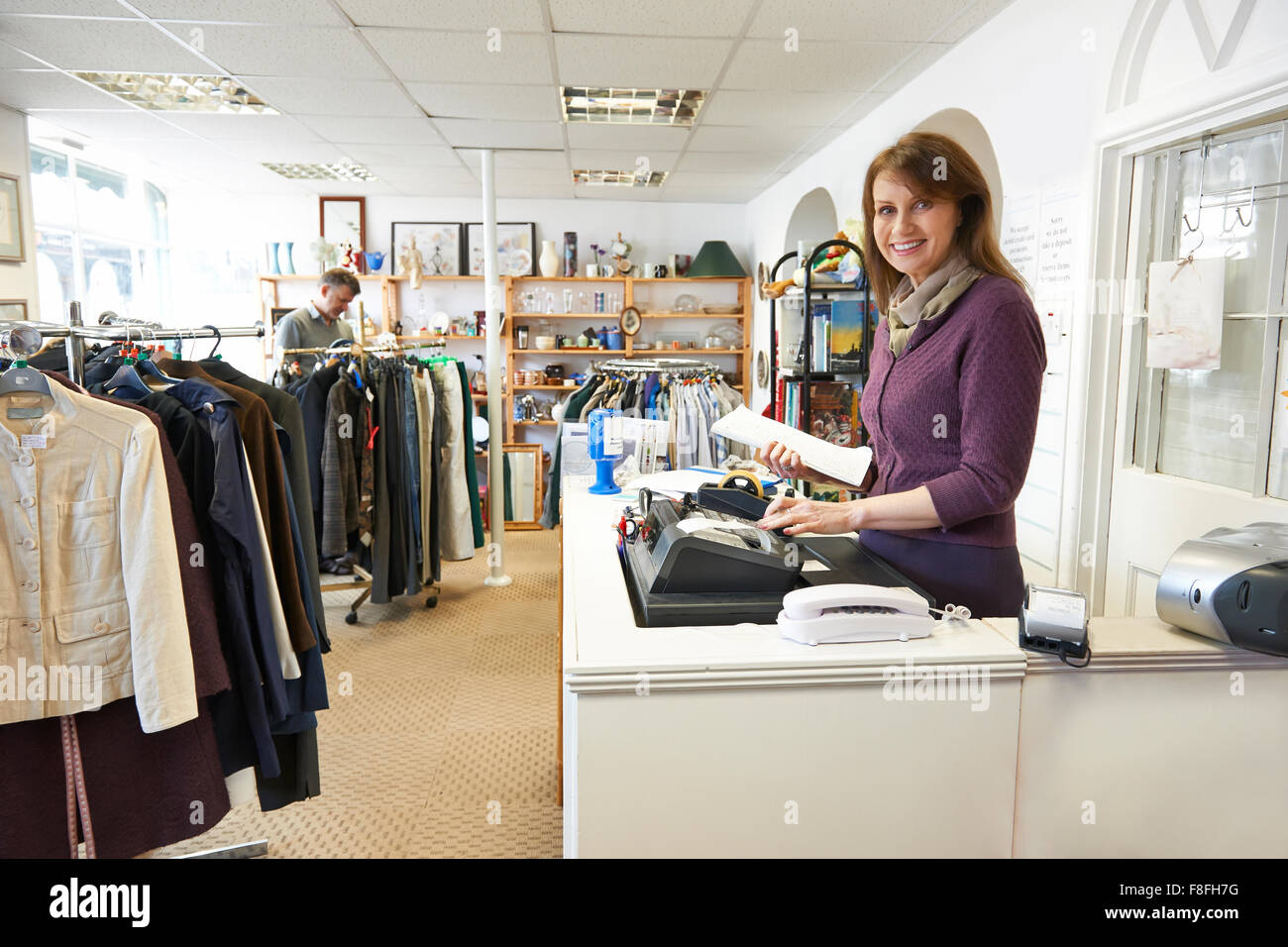 Shop Assistant And Customer High Resolution Stock Photography and ...