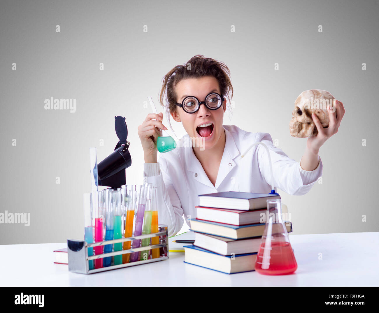 Crazy female chemist in lab Stock Photo - Alamy