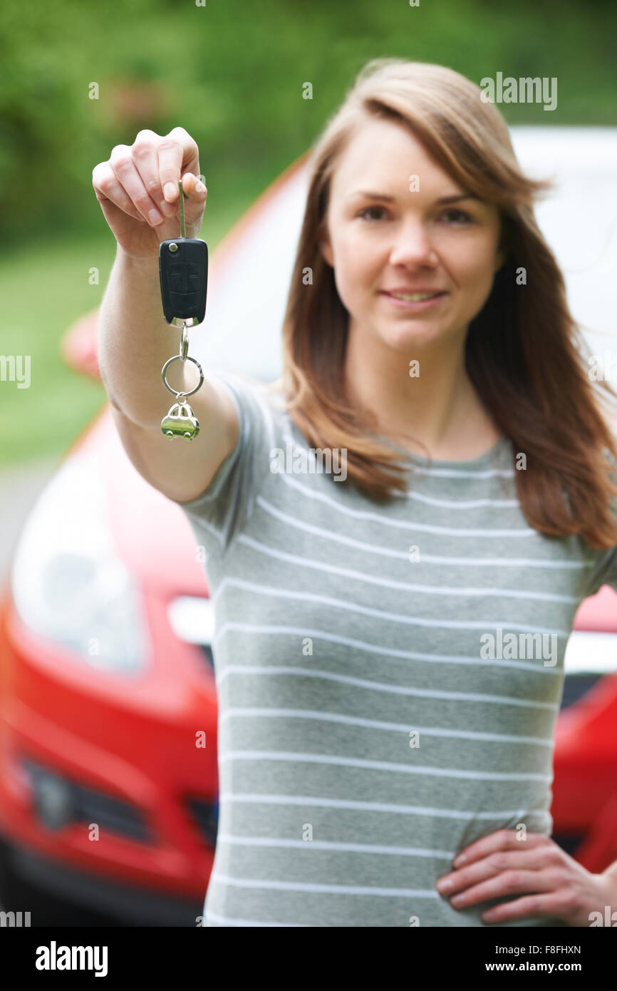 Young Female Driver Holding Car Keys In Front Of Vehicle Stock Photo ...