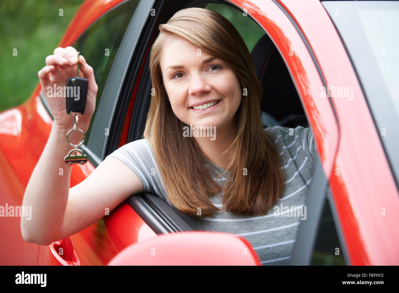 Young Female Driver In Car Holding Keys Stock Photo - Alamy