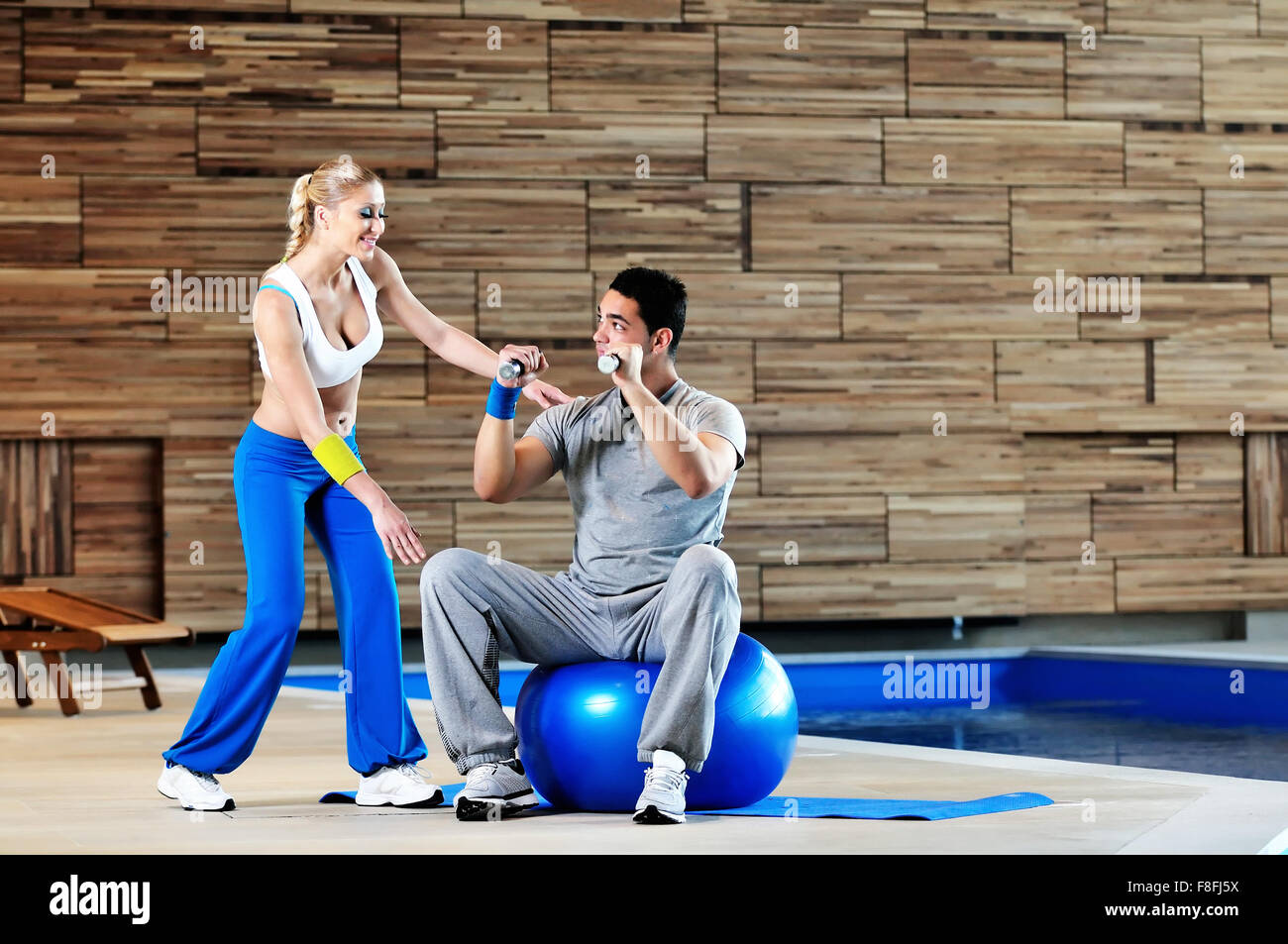 fitness personal trainer on fitness classes supporting group of people ...