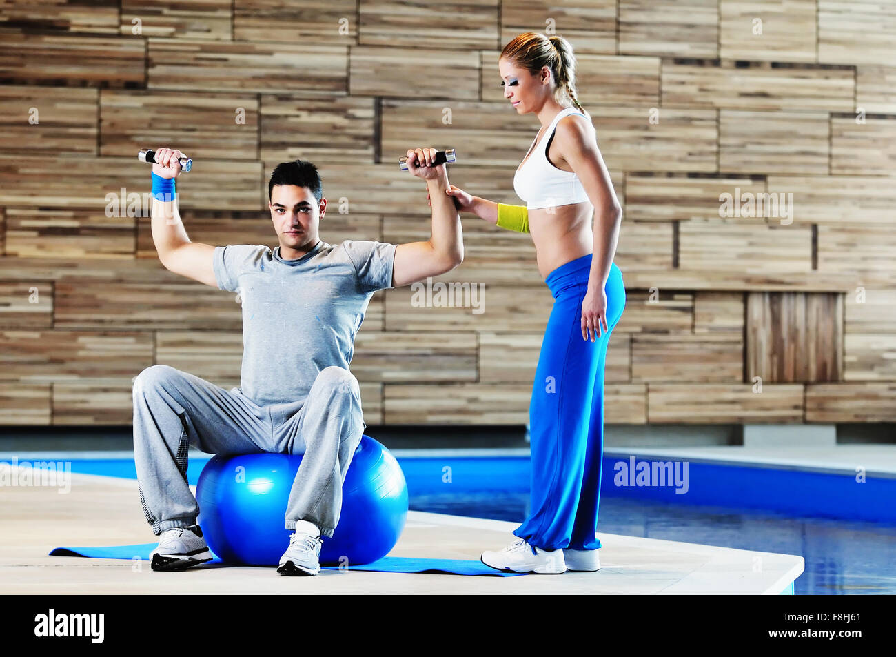 fitness personal trainer on fitness classes supporting group of people ...