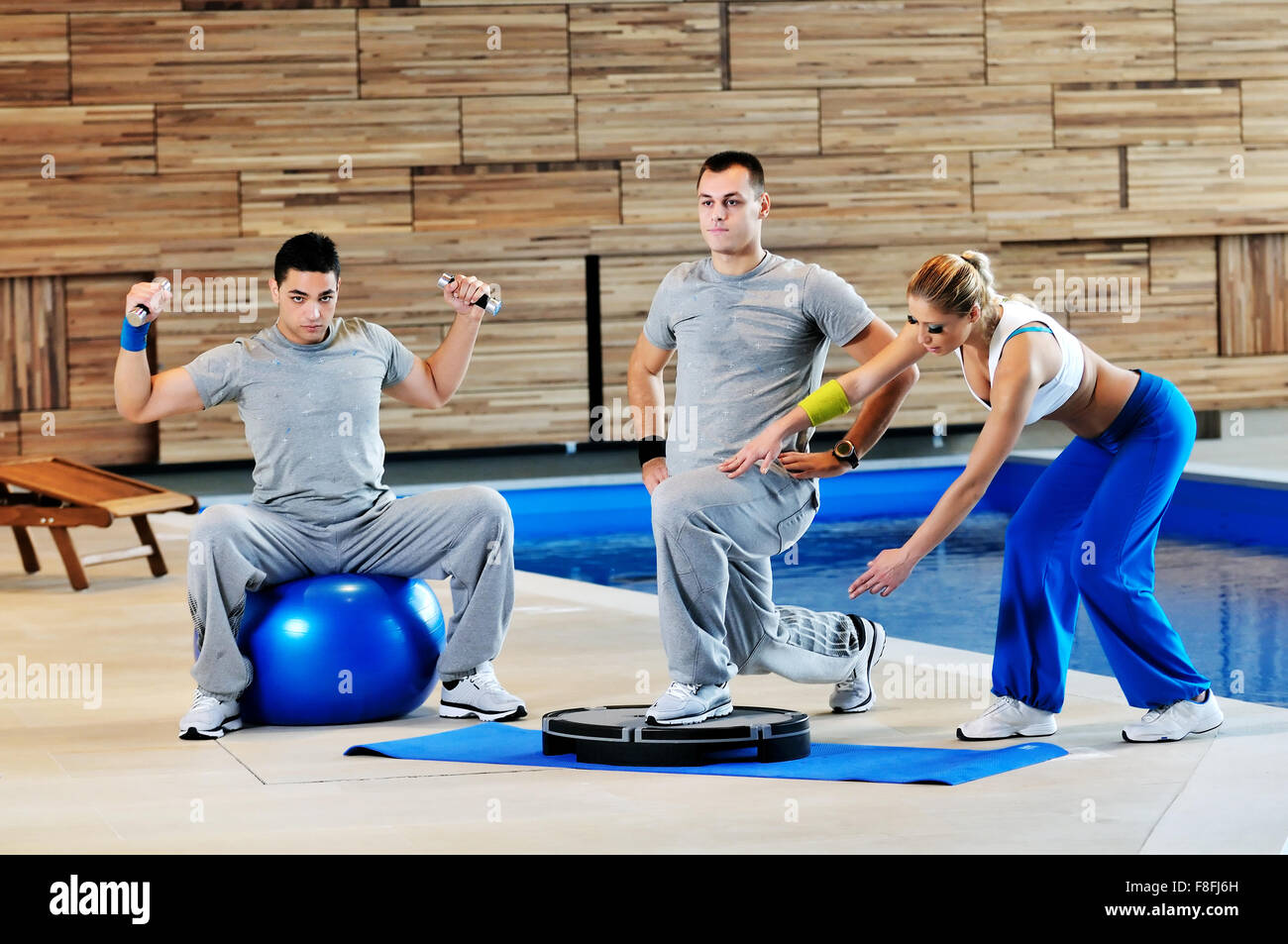 fitness personal trainer on fitness classes supporting group of people ...