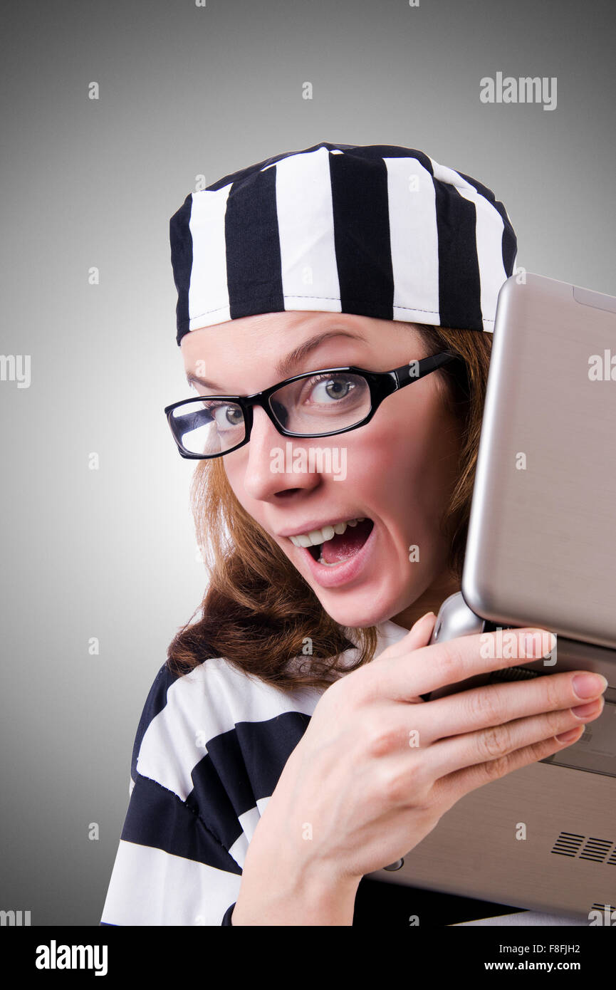 Criminal hacker with laptop against gradient Stock Photo - Alamy