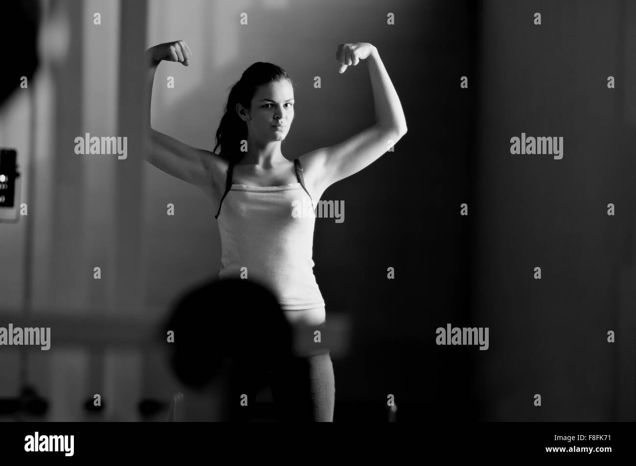 Girl with strong biceps Black and White Stock Photos & Images - Alamy