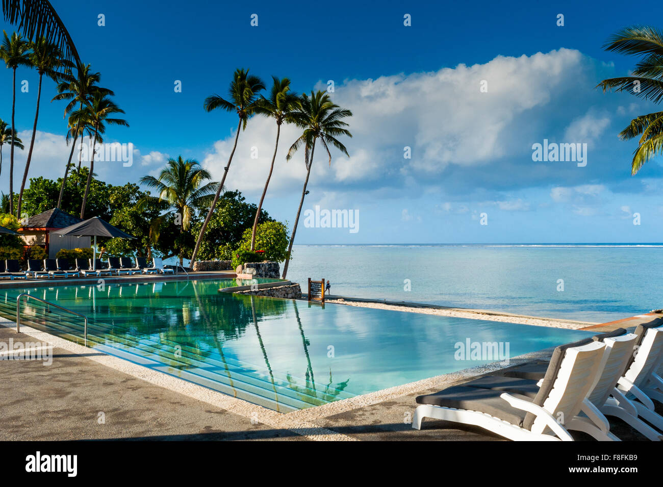 A stunning infinity swimming pool and beach on the tropical Island of ...