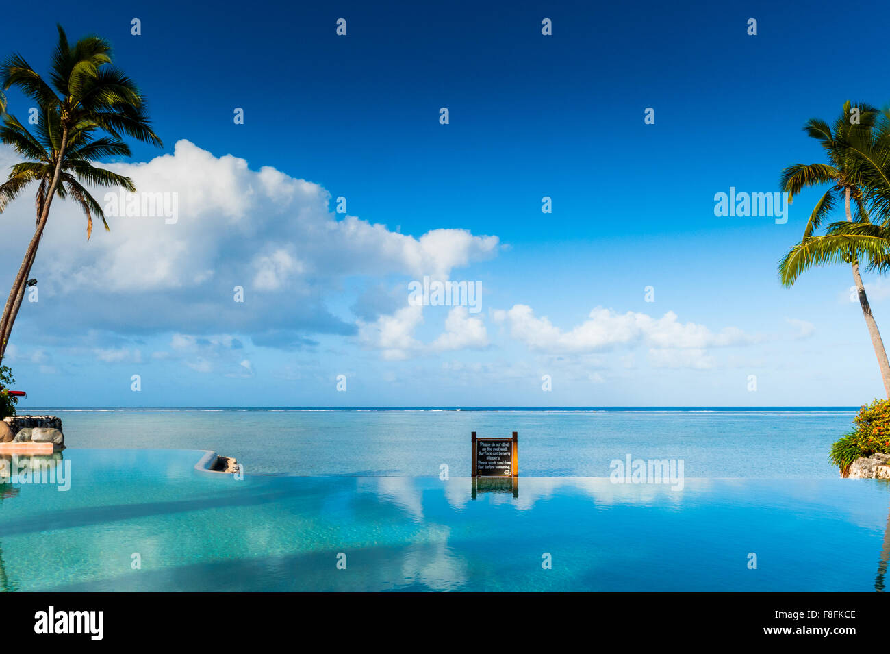 A stunning infinity swimming pool and beach on the tropical Island of ...