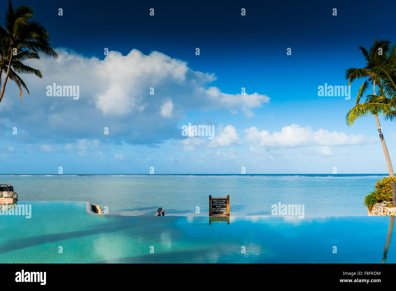 A stunning infinity swimming pool and beach on the tropical Island of ...