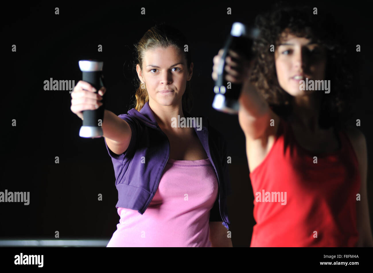 two women work out and streaching in fitness club Stock Photo - Alamy