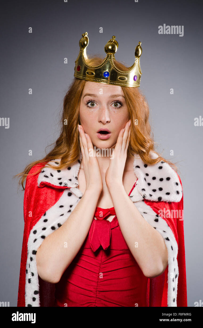 Pretty young queen in red dress isolated on white Stock Photo - Alamy