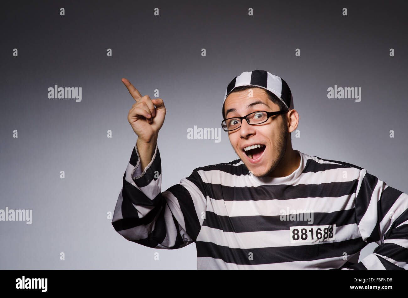 Funny prisoner isolated on gray Stock Photo - Alamy
