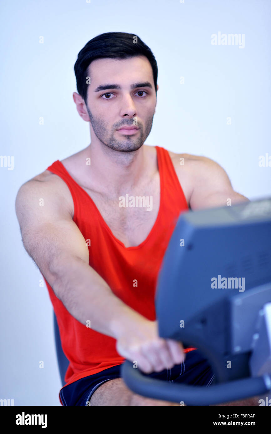Handsome man running on the treadmill in modern gym Stock Photo - Alamy