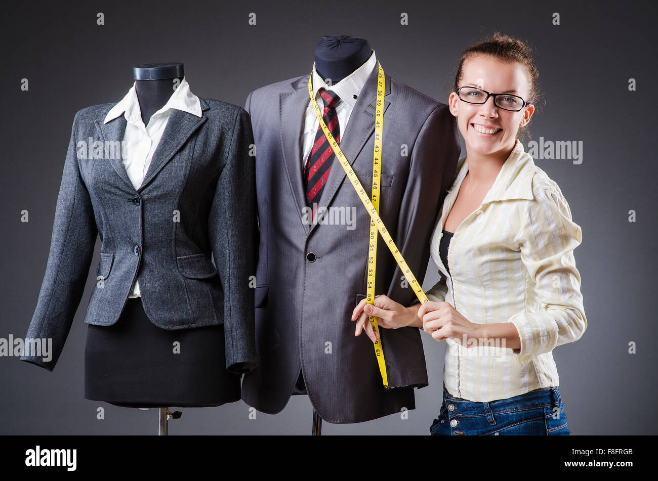 Woman tailor working on clothing Stock Photo - Alamy