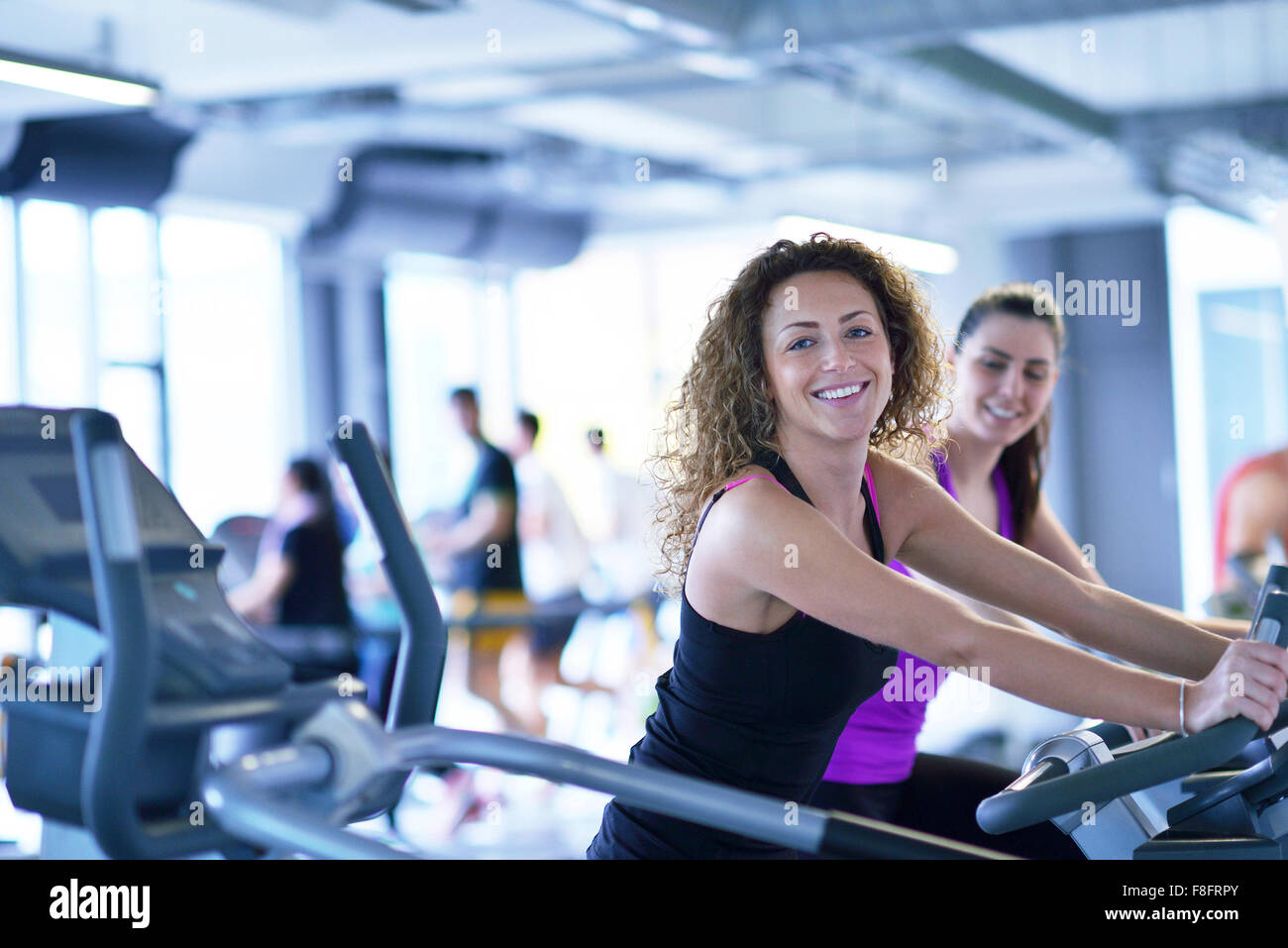 group of young people running on treadmills in modern sport gym Stock ...