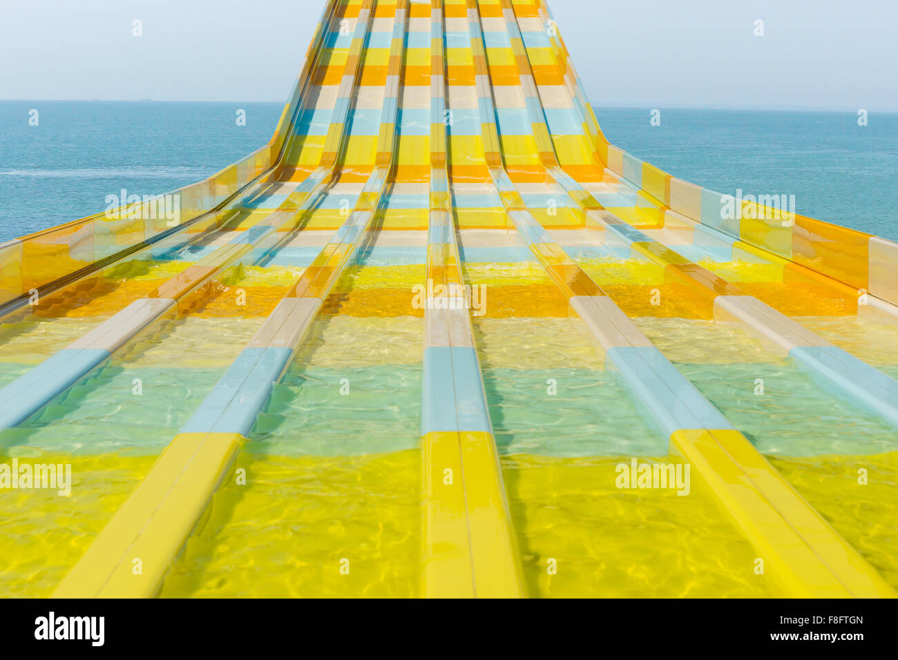 Colorful water feature slide at a resort or amusement park curving ...