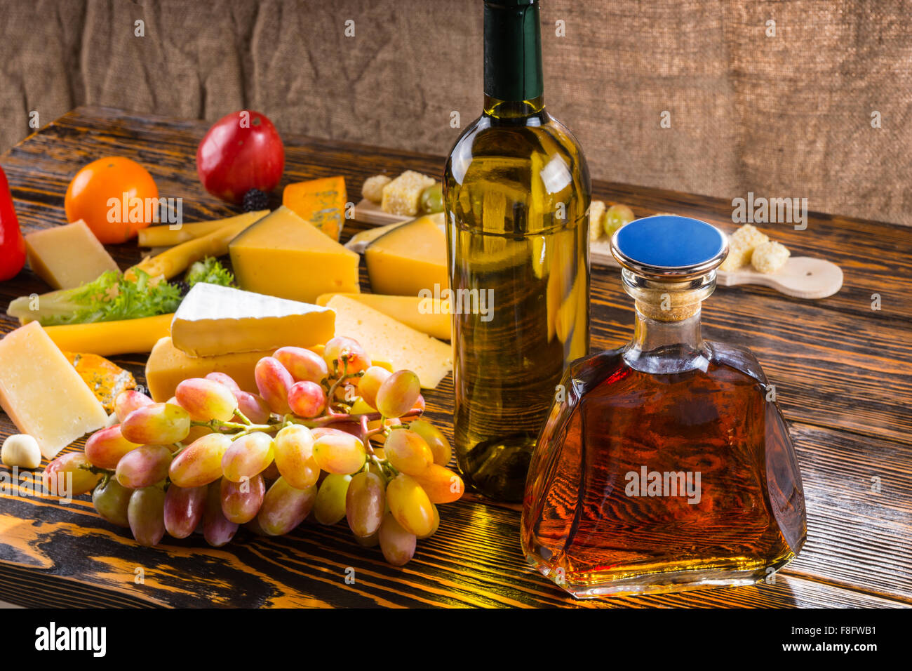 Gourmet cheese platter with a large assortment of different cheeses and ...