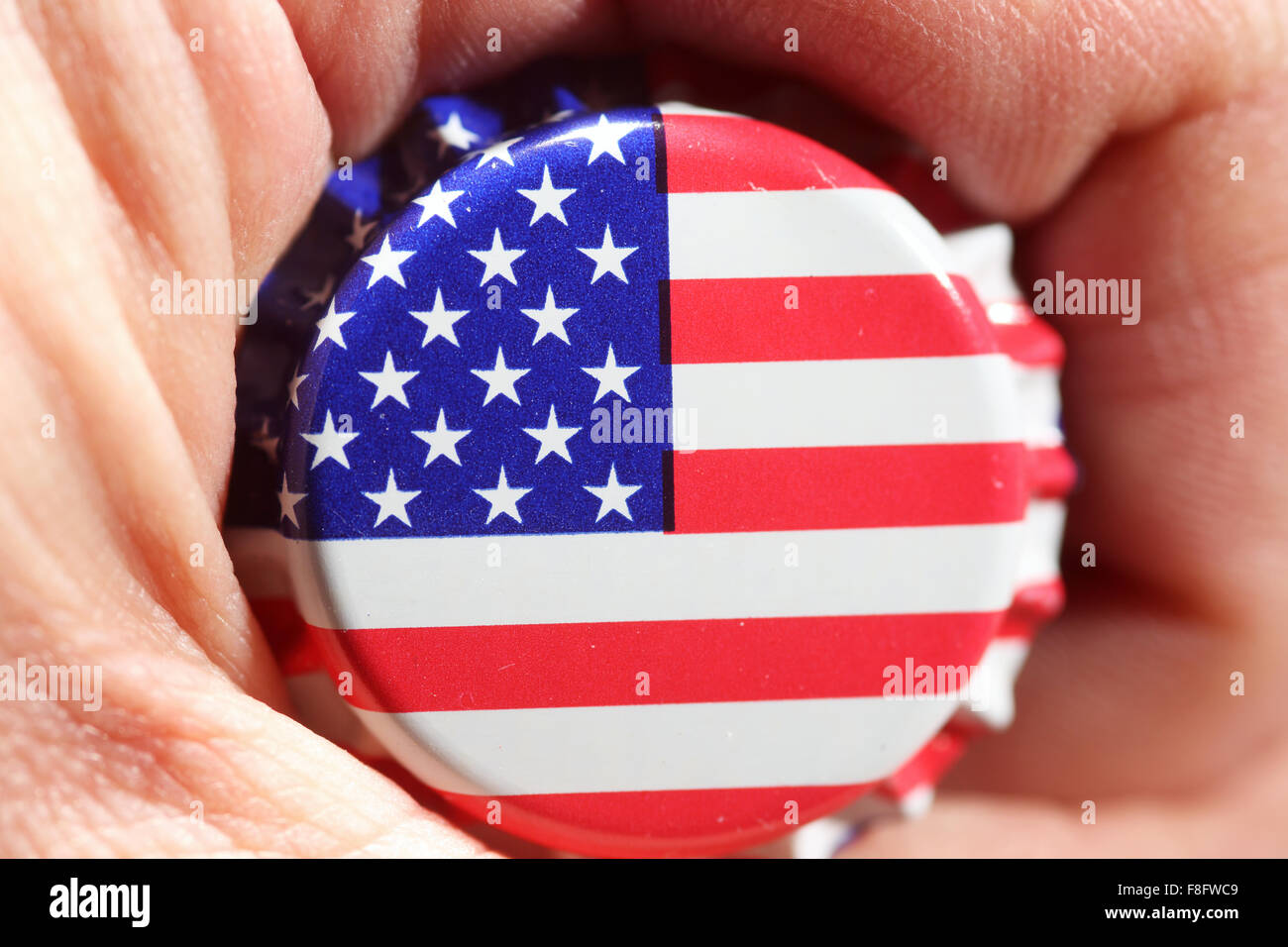 stars and stripes twist off beer cap in fist Stock Photo - Alamy