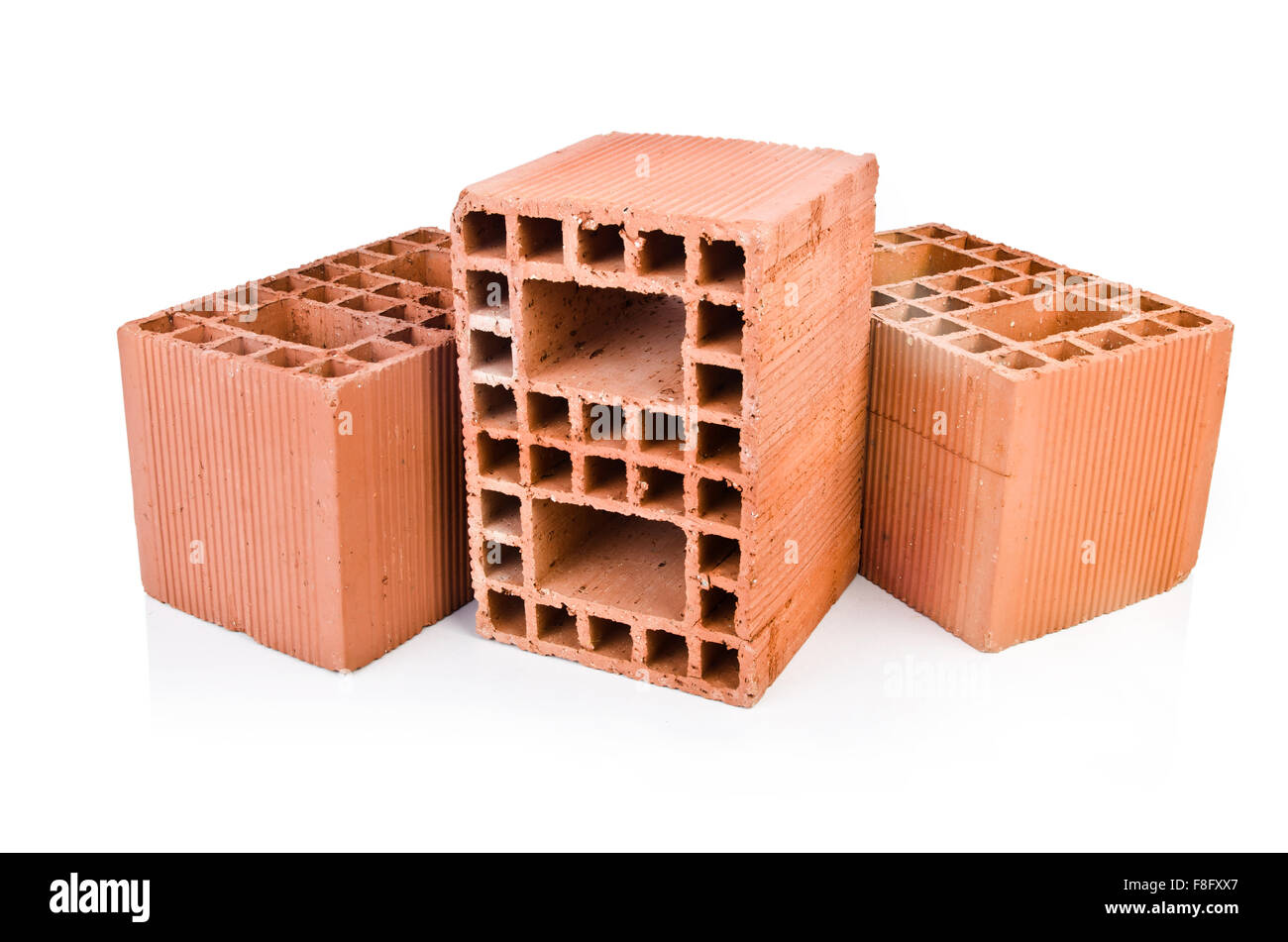 Stack of clay bricks isolated on white Stock Photo - Alamy